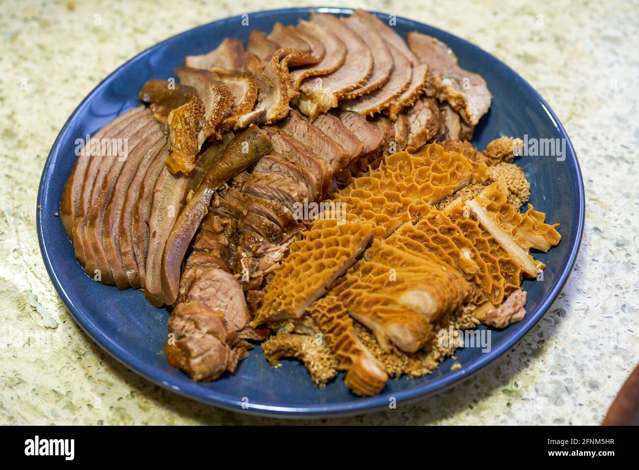 A delicious Chinese dish, a platter of braised vegetables, tripe and ...