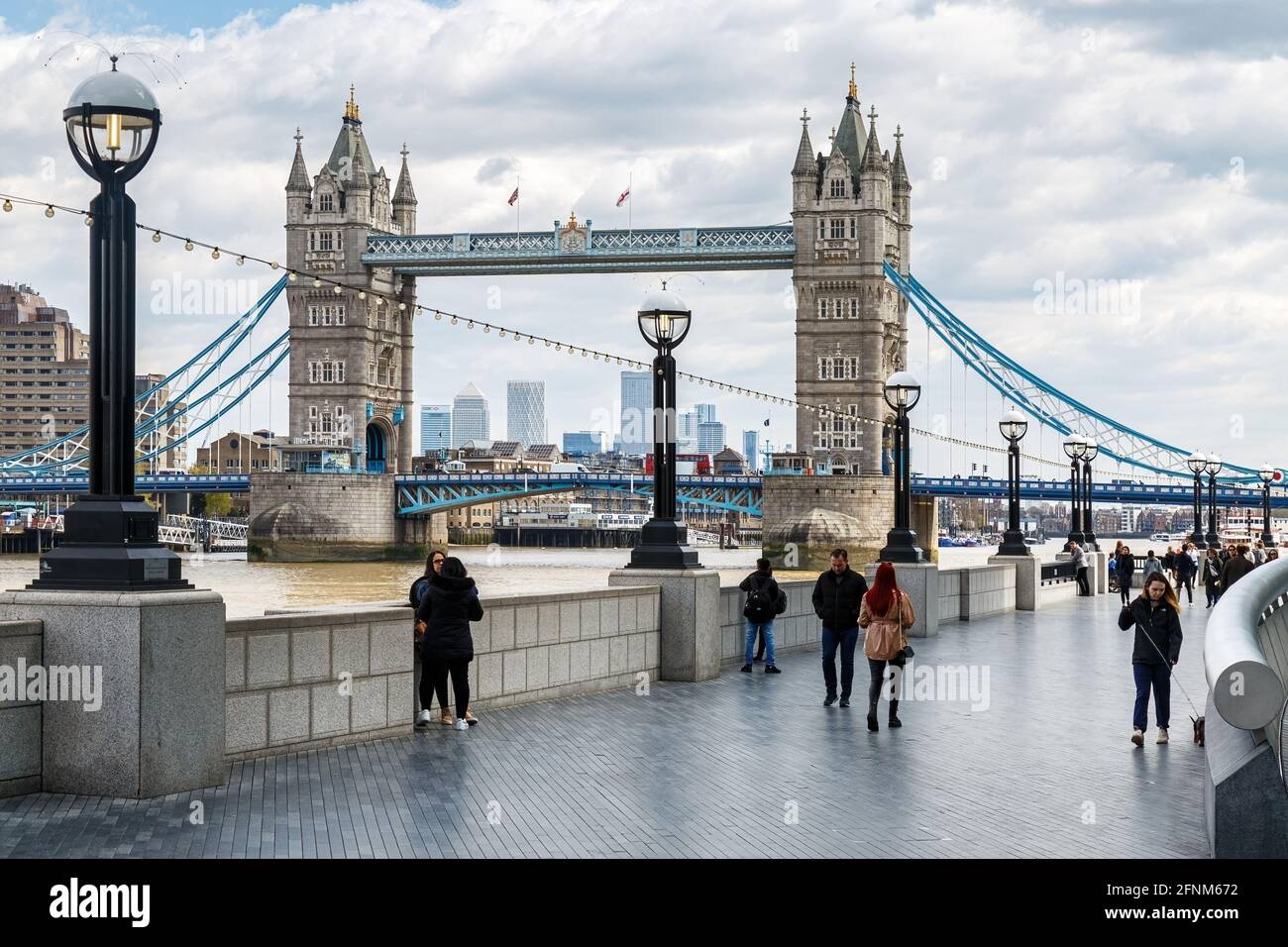 A view of Tower Bridge from the South Bank Thames Path with socially ...