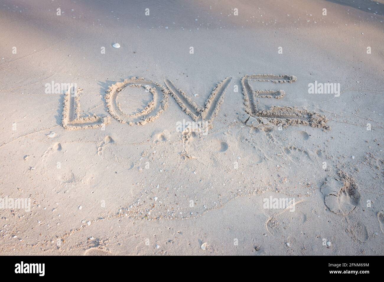 love message written in sand background Stock Photo - Alamy