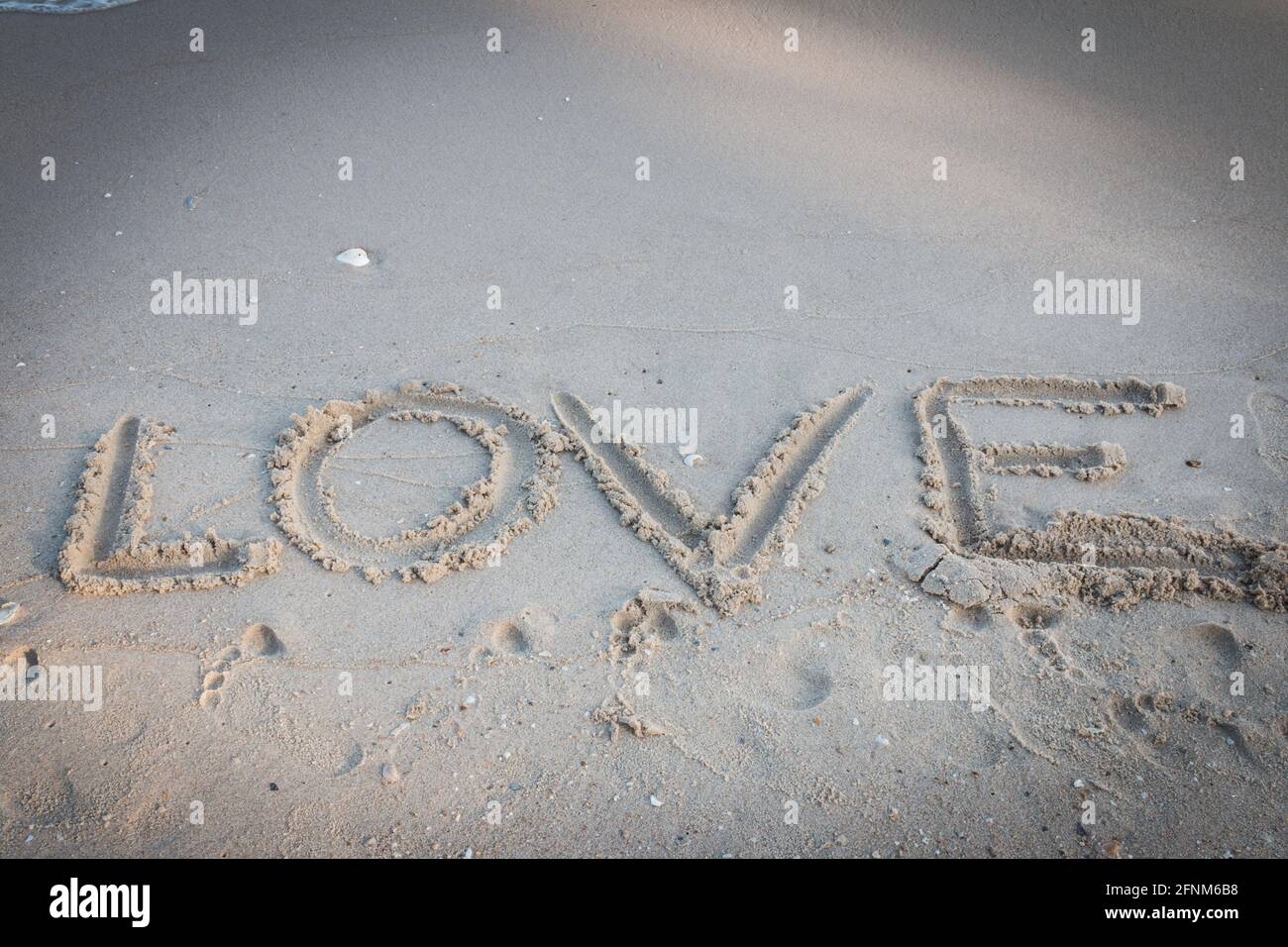 love message written in sand background Stock Photo - Alamy