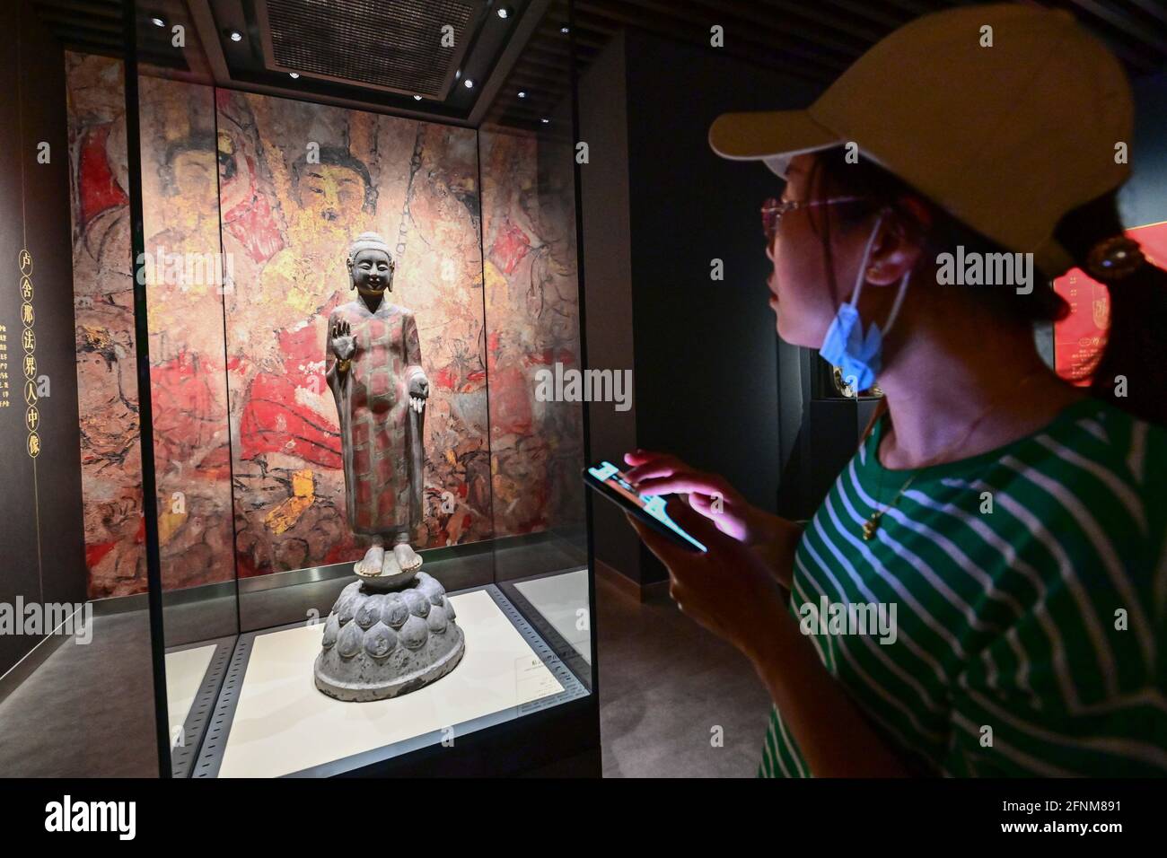 QINGZHOU, CHINA - MAY 18, 2021 - Visitors look at an exhibition at a ...