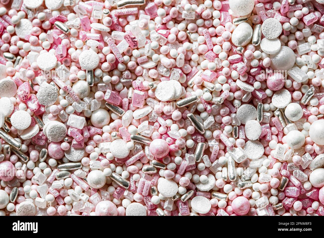 Closeup of colourful sugar sprinkles, cake decor. Top view Stock Photo ...