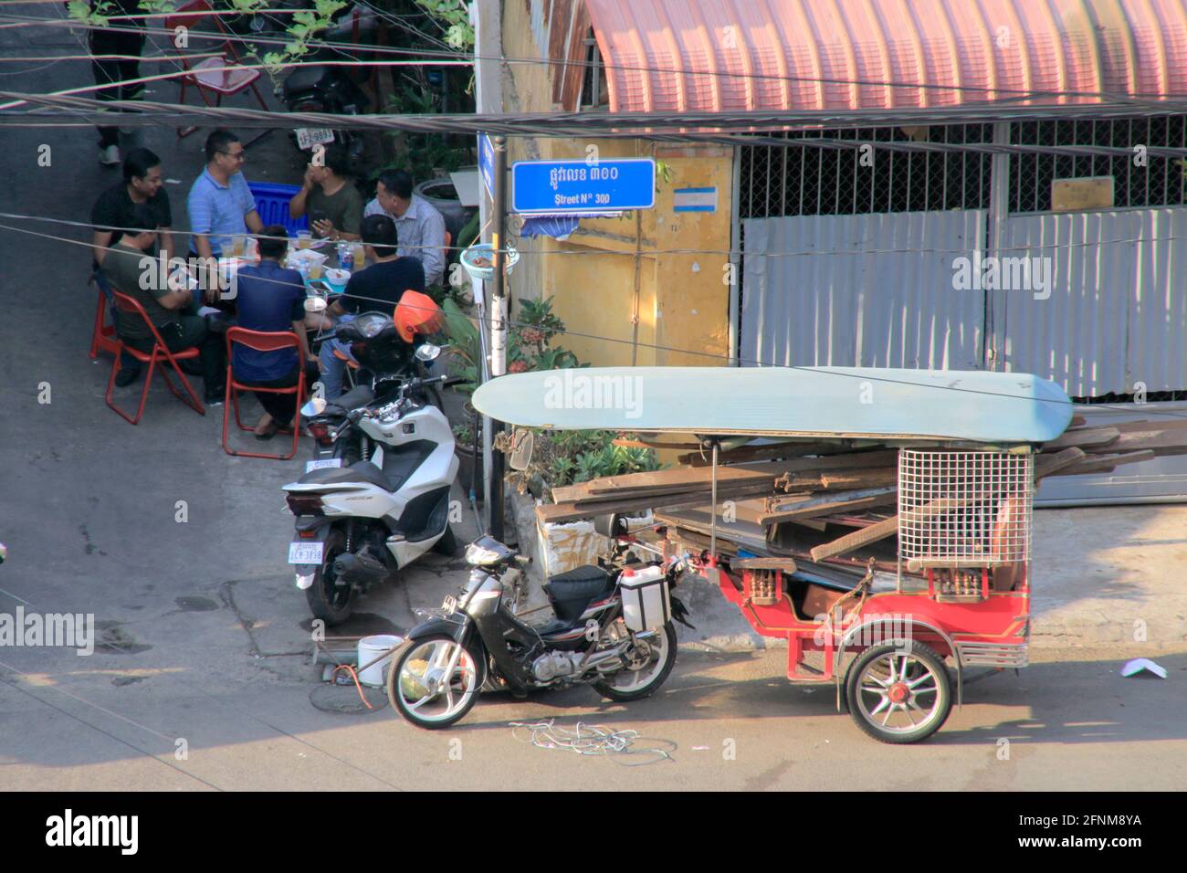 Tuk Tuk Taxi on a local street in Phnom Penh Cambodia Stock Photo - Alamy