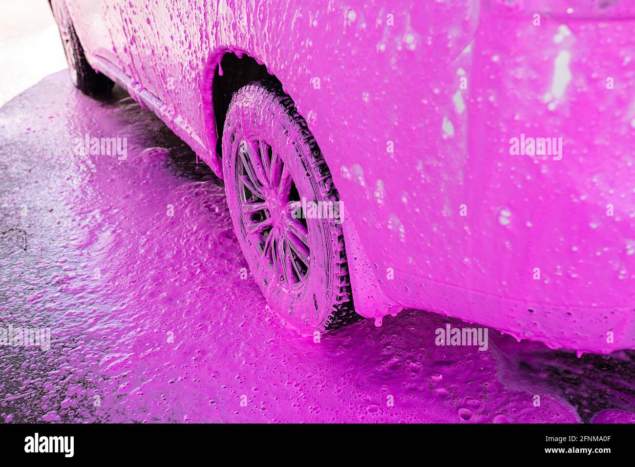 Cleaning, car wash, pink foam, background Car wheels stock photo Stock ...