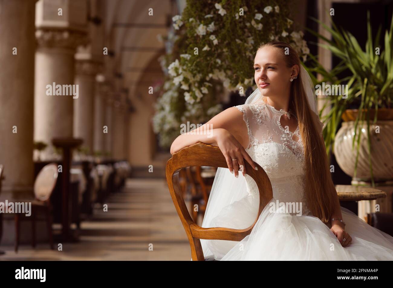 Bride sitting on chair hi-res stock photography and images - Alamy