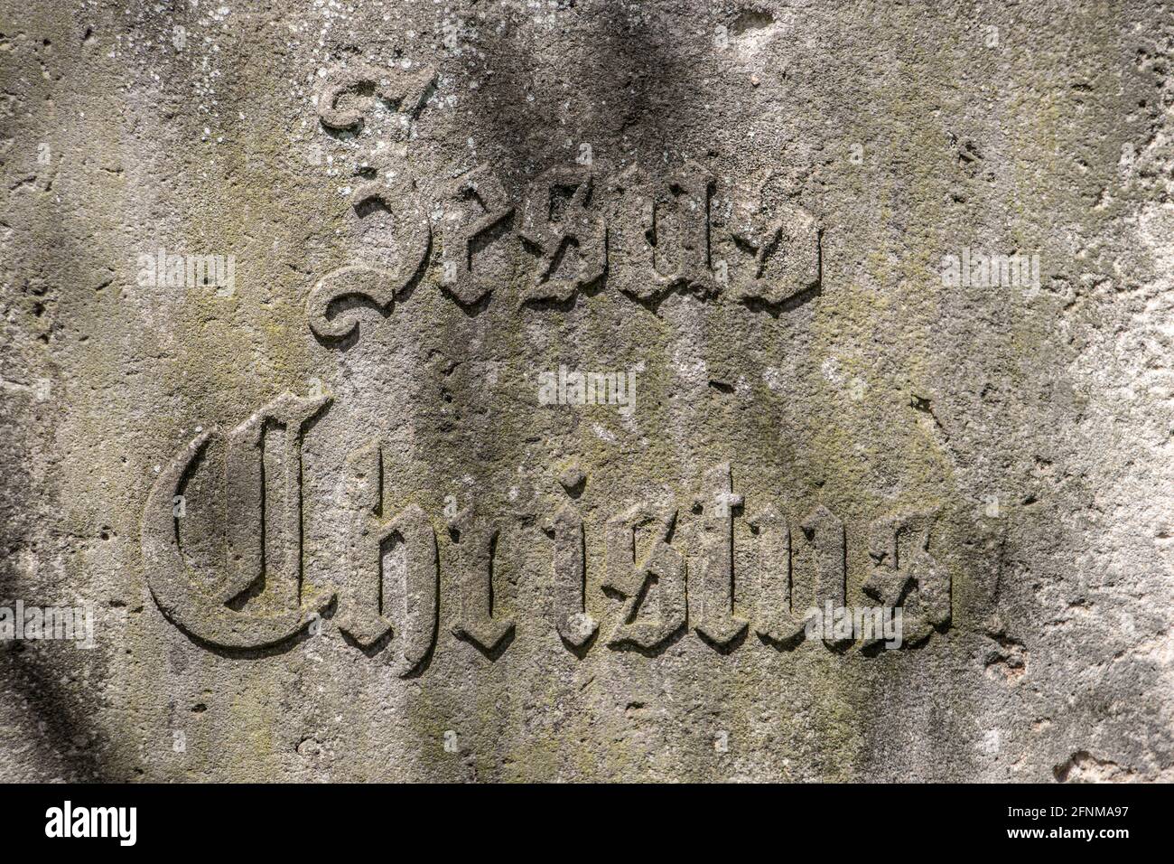 The name of Jesus Christ carved in a stone block Stock Photo - Alamy