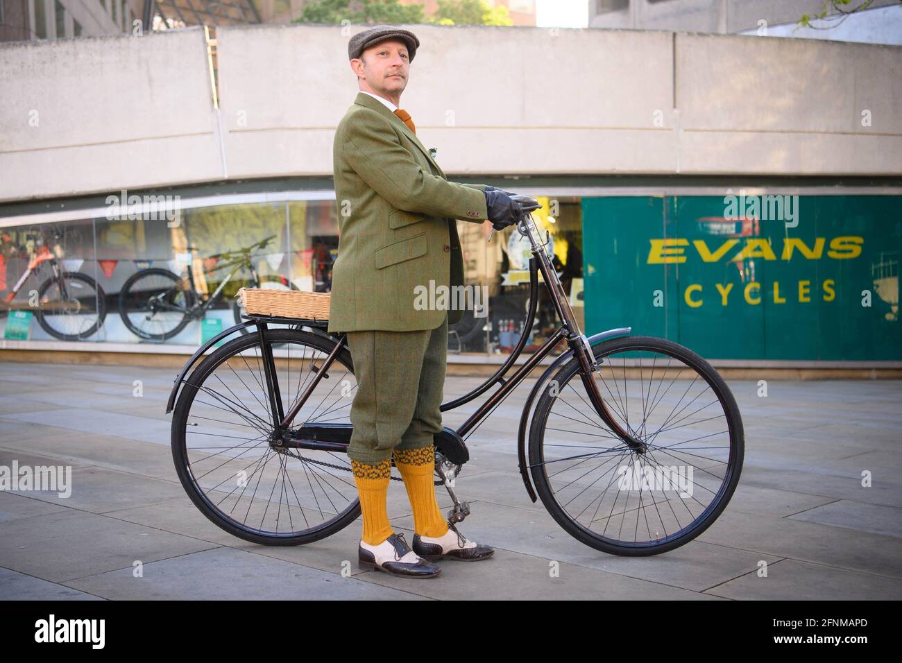 EDITORIAL USE ONLY Cyclist, Russell rides a bicycle from the 1920s ...