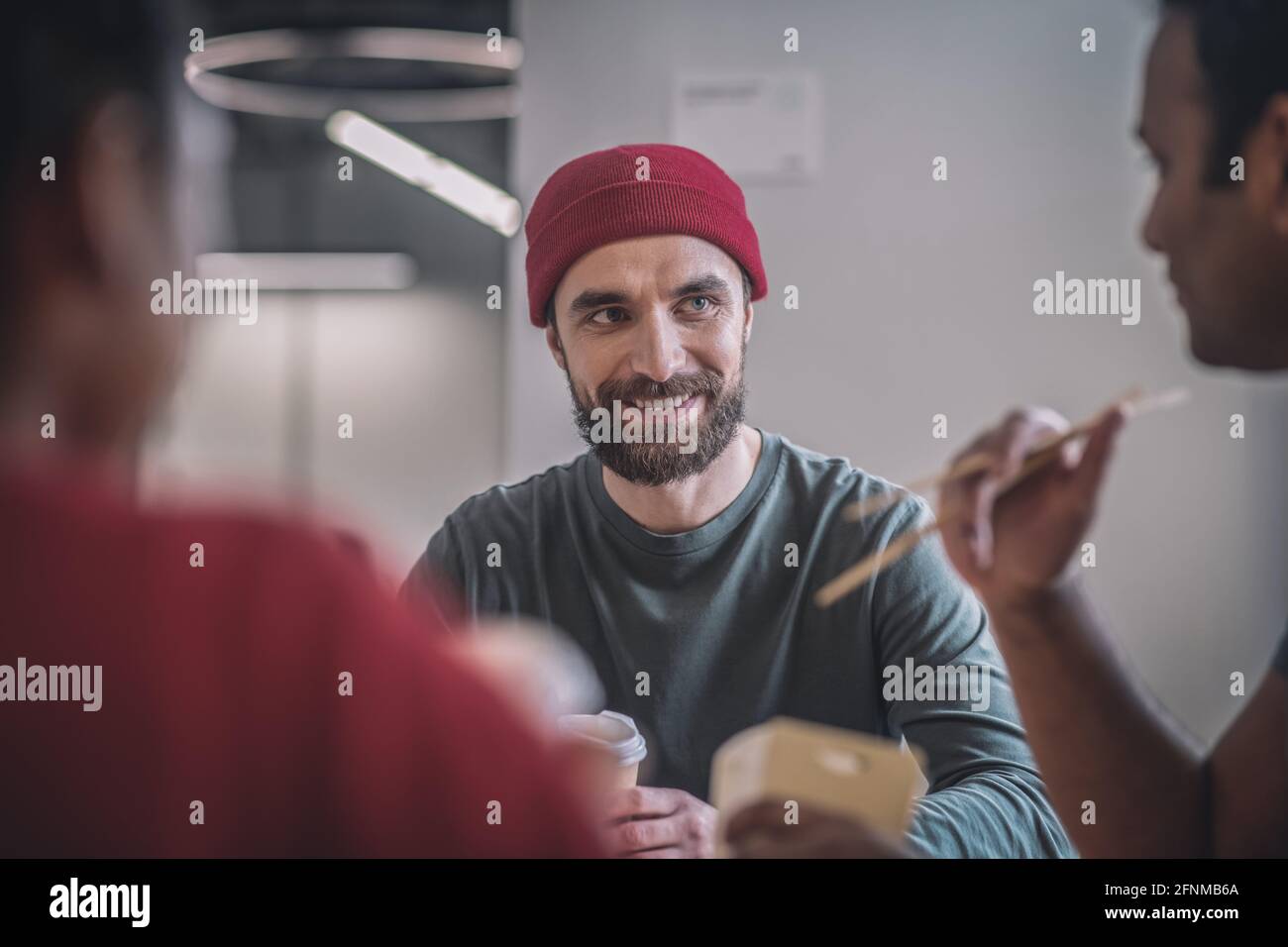 Colleagues having lunch together office hi-res stock photography and ...