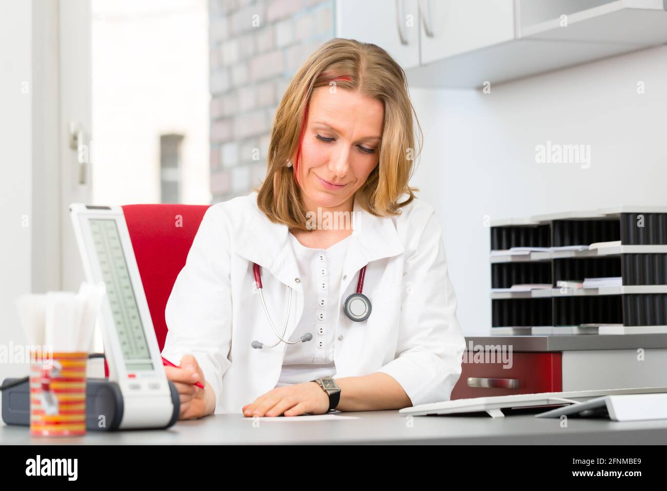 Doctor and surgery and female desk hi-res stock photography and images ...
