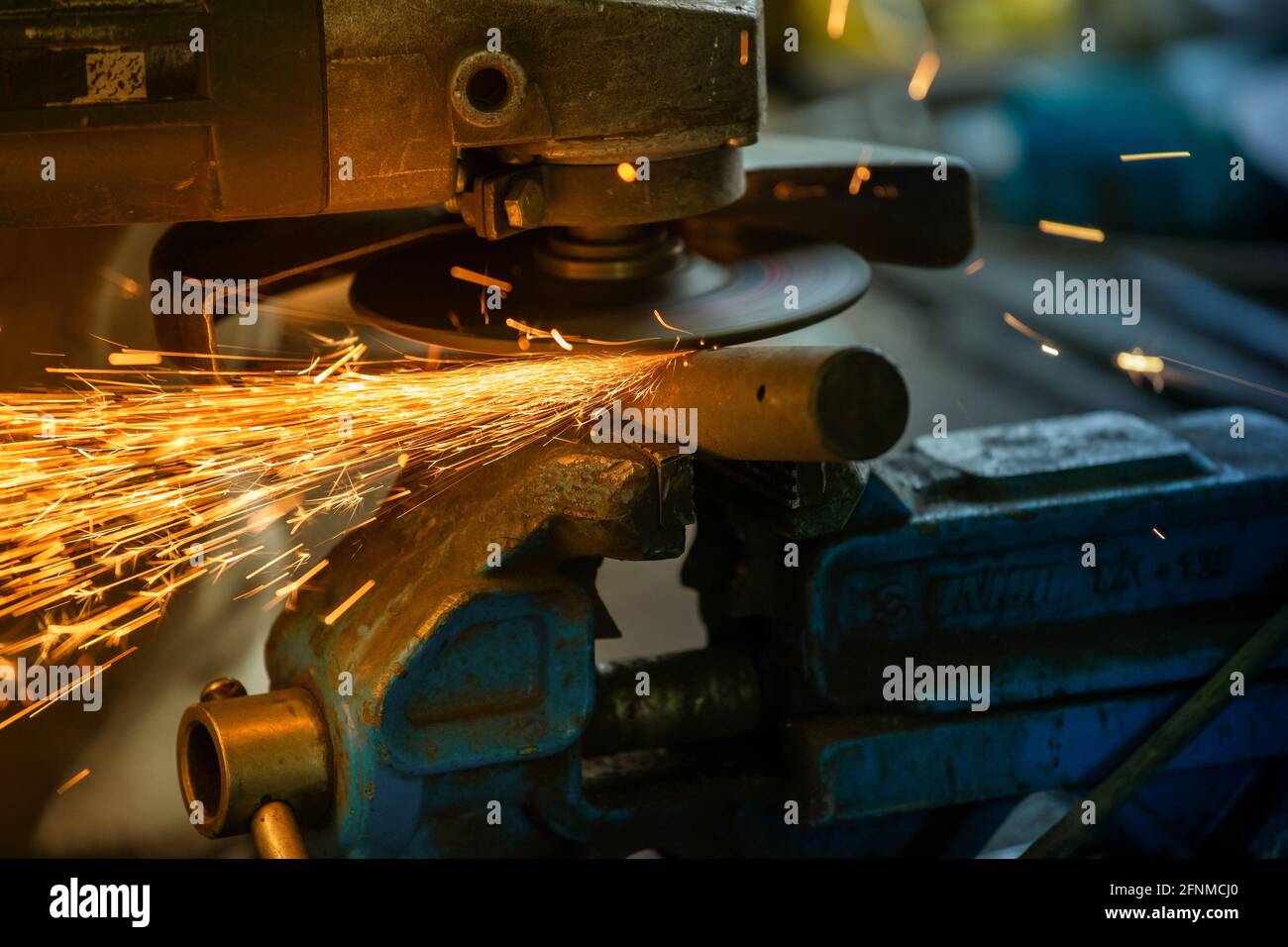 Close up of metal disk grinding steel pipe in factory Stock Photo - Alamy