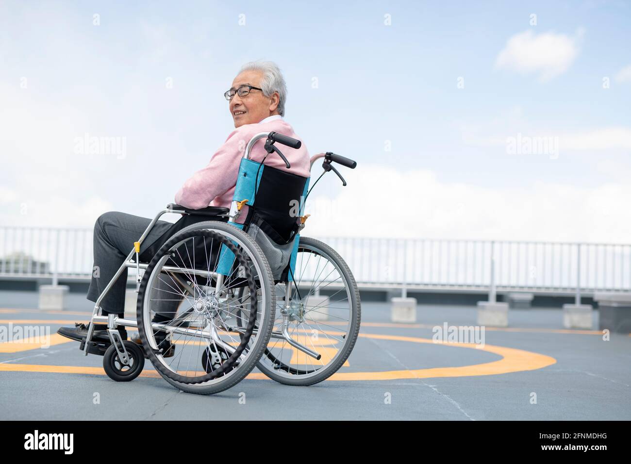 Adult man in wheelchair using hi-res stock photography and images - Alamy