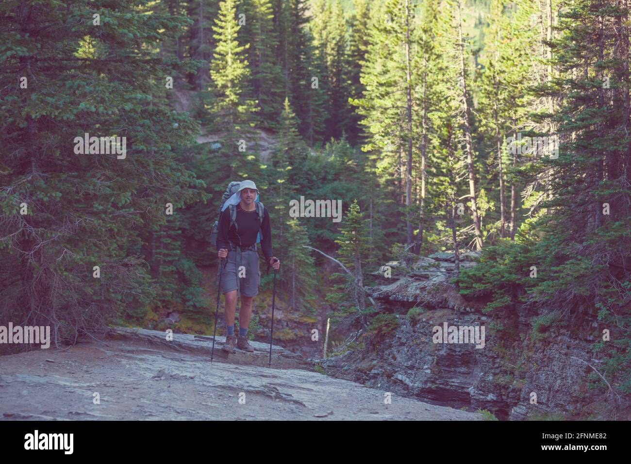 Backpacker in the summer mountains Stock Photo - Alamy