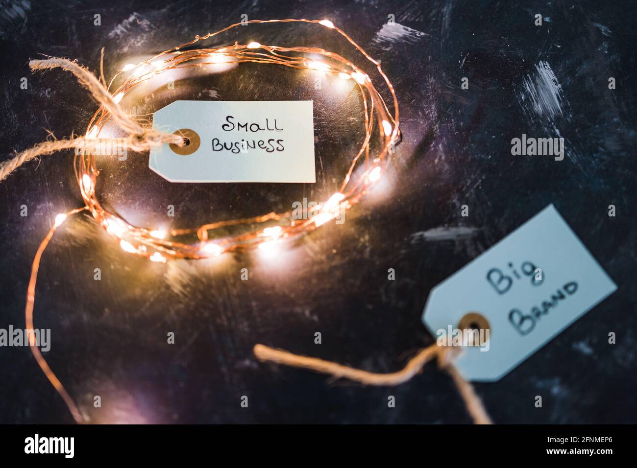 product tags with small business vs big brand texts with fairy lights ...