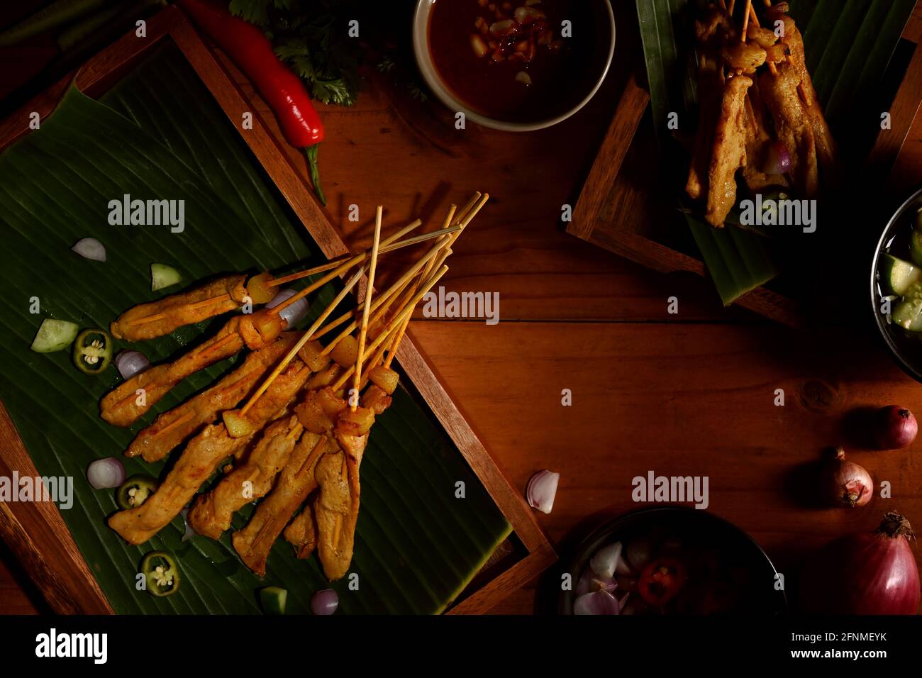 Top view of Grilled pork satay (Moo Satay) served with peanut sauce on ...