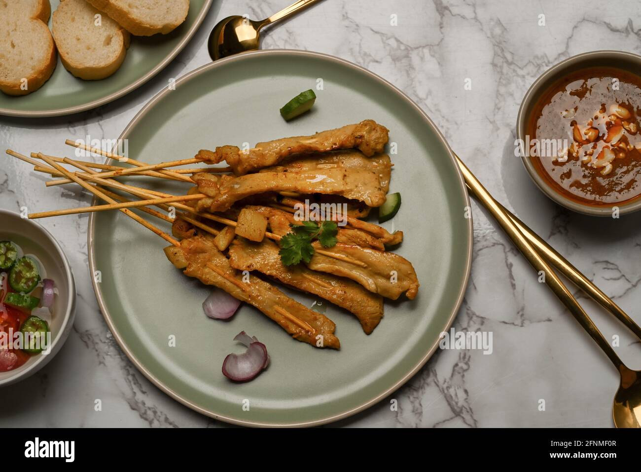 Top view of marble dinning table with Grilled pork satay (Moo Satay ...
