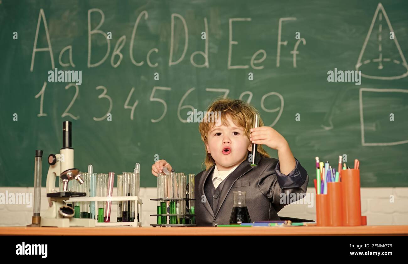 Back to school. Pupil looking through microscope . student do science ...