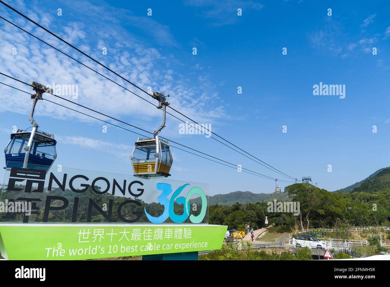 The Ngong Ping 360 Cable Car in Hong Kong, with banner "The world's 10 best cable car experience ...