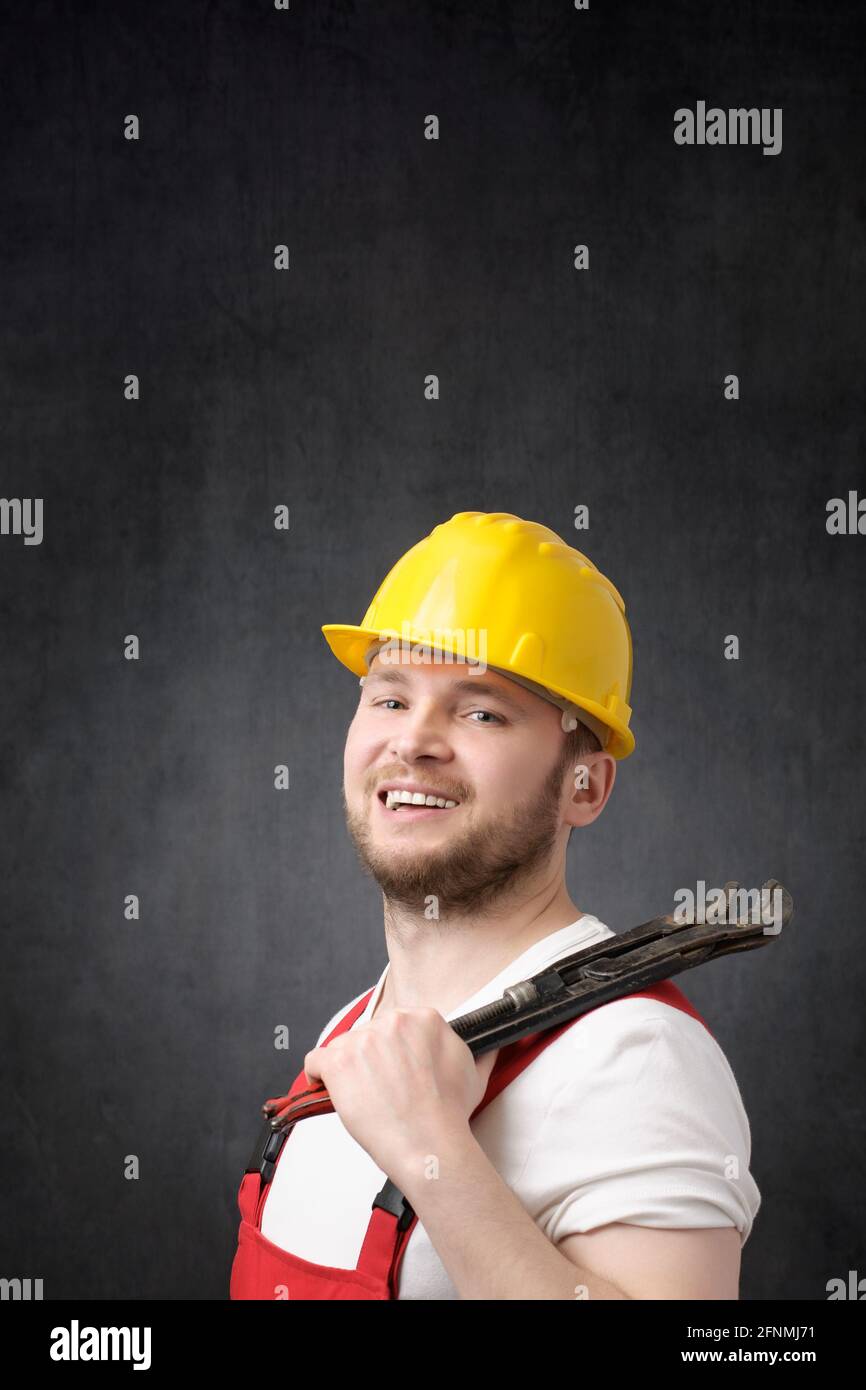 Portrait of a happy, smiling plumber Stock Photo - Alamy