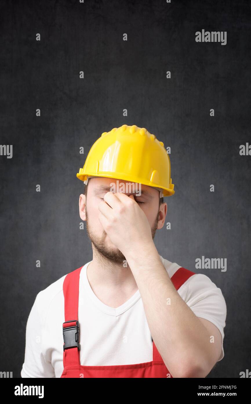 Portrait of a tired construction worker Stock Photo - Alamy