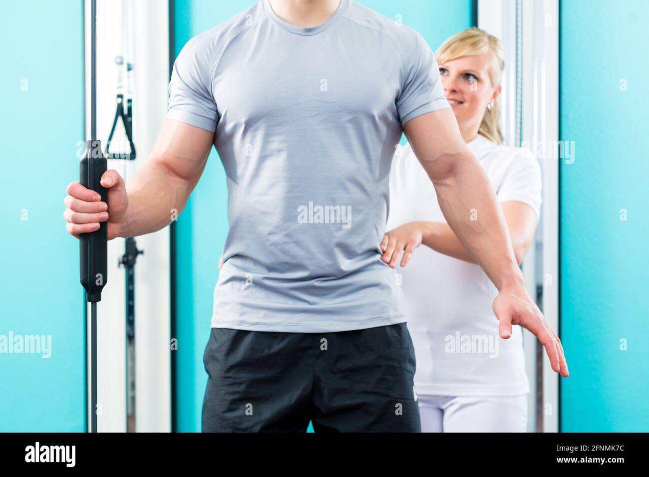 Patient at the physiotherapy doing physical exercises using flexi bar ...