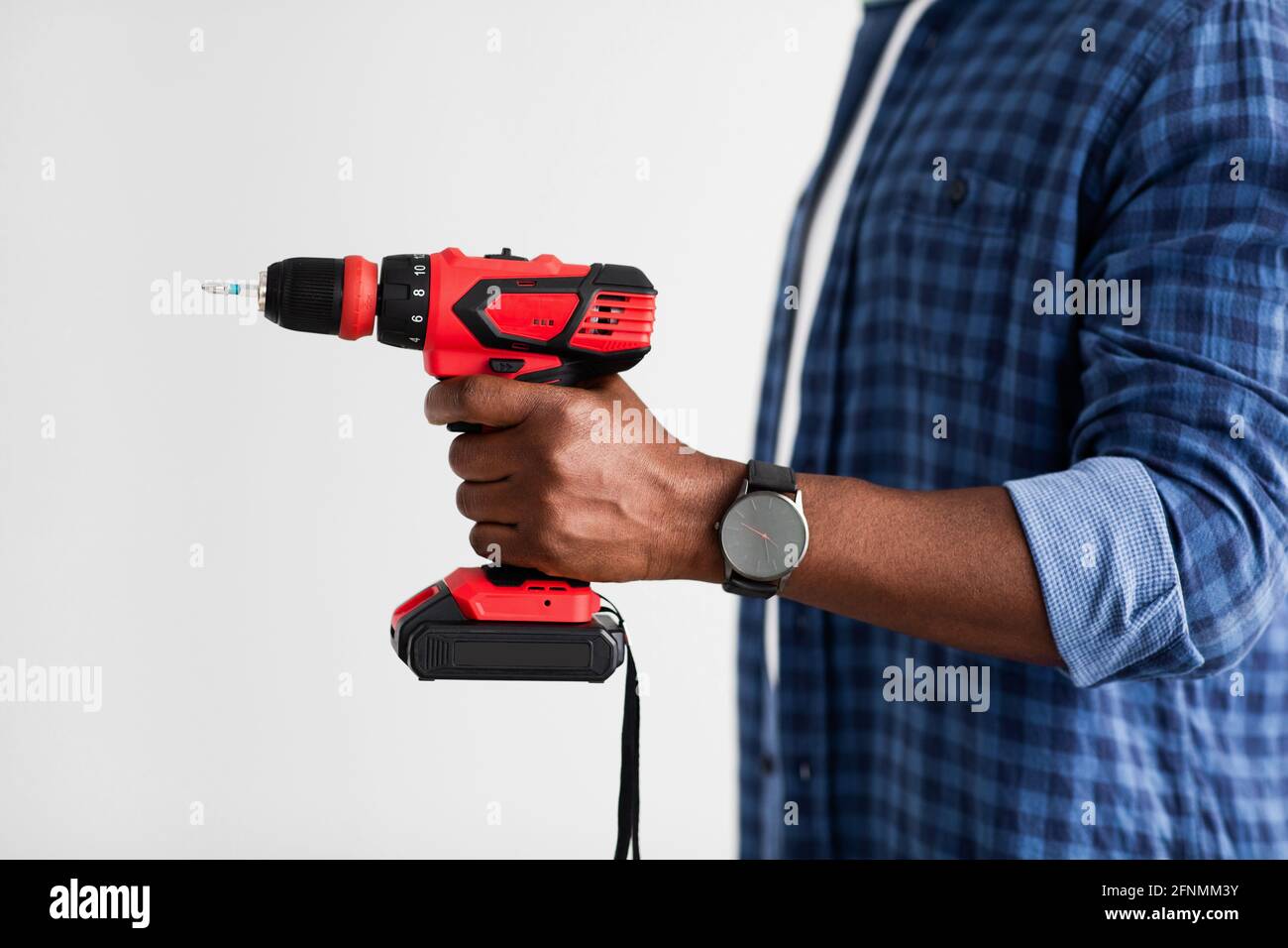 African american driller man with electric screwdriver, ready to repair ...