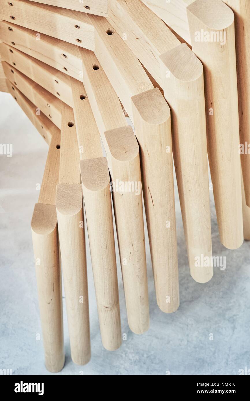 Stacks of new wooden bases with simple legs for elegant chairs ...