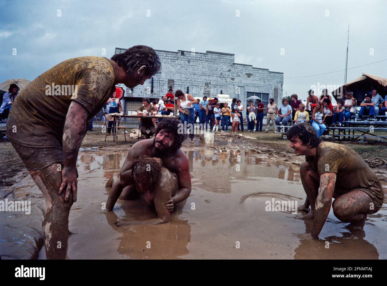 Mud wrestling, Fun in the mud, Muddy fair day goers, Simcoe Ontario ...