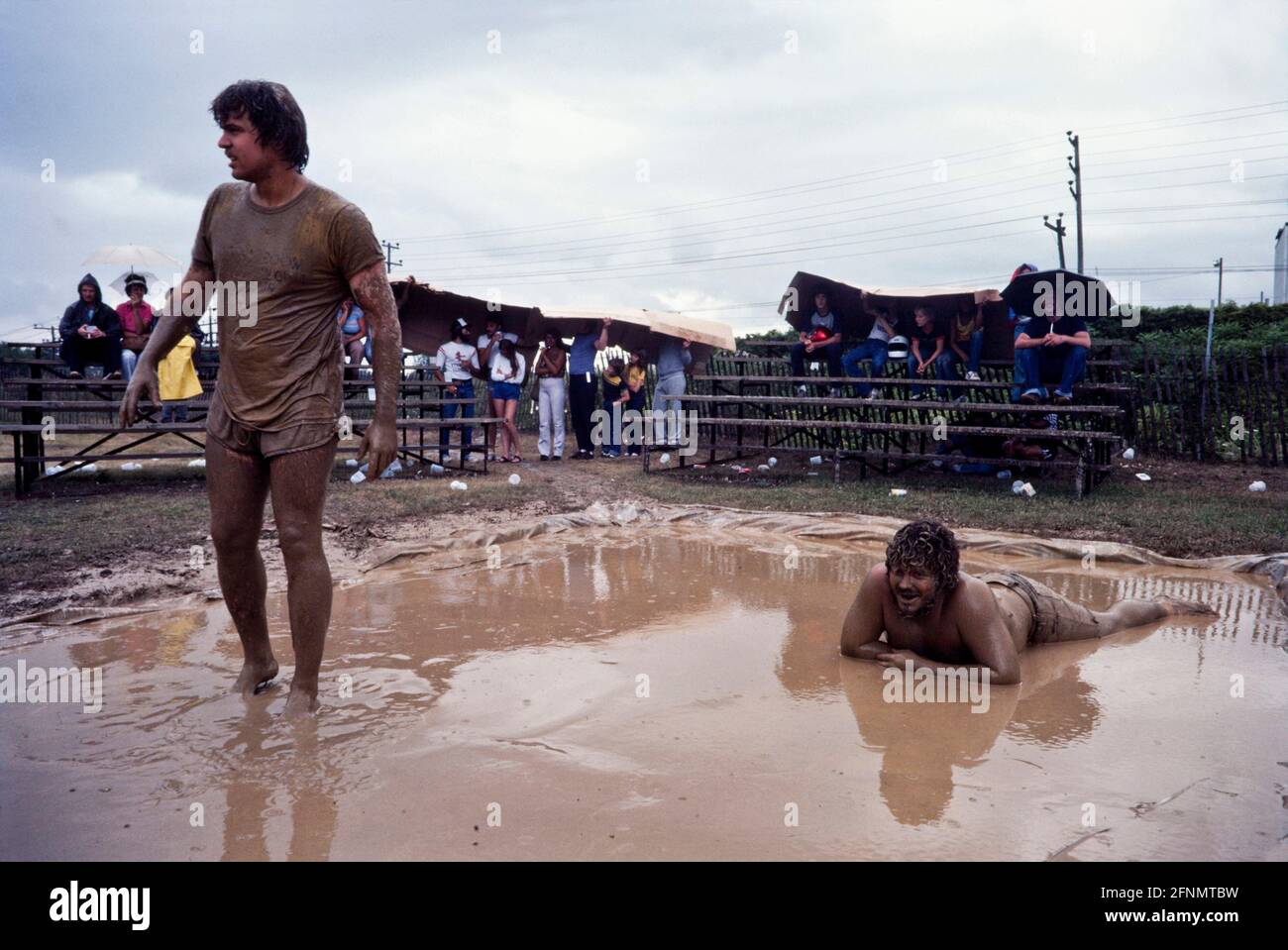 Mud wrestling, Fun in the mud, Muddy fair day goers, Simcoe Ontario ...