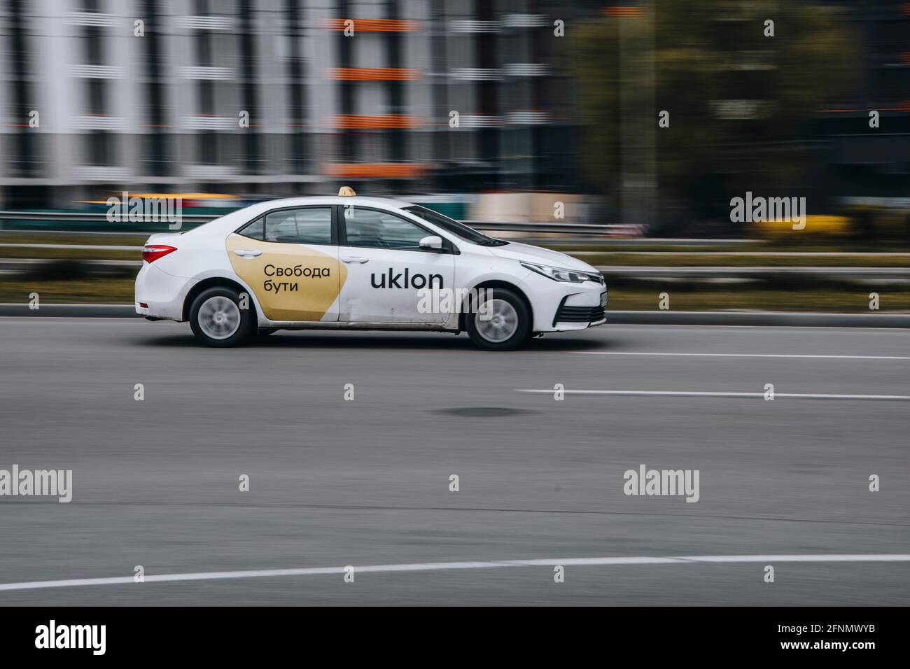 Ukraine, Kyiv - 26 April 2021: White Toyota Corolla Taxi Uklon car ...