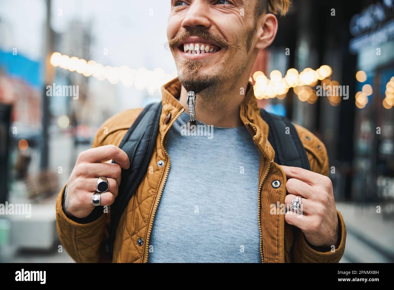 Contented smile of happy male young tourist Stock Photo - Alamy