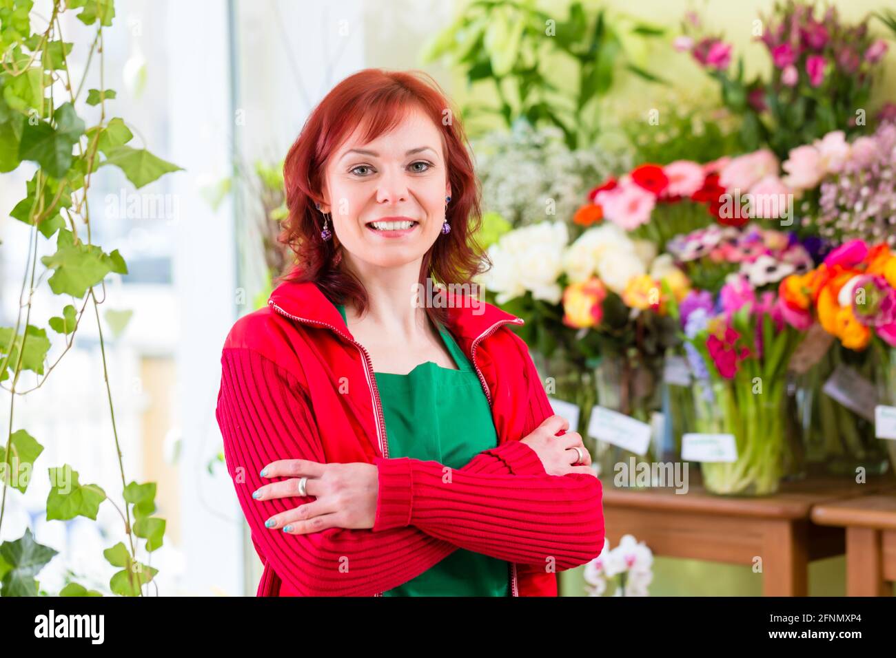 Caucasian florist selling bouquets hi-res stock photography and images ...