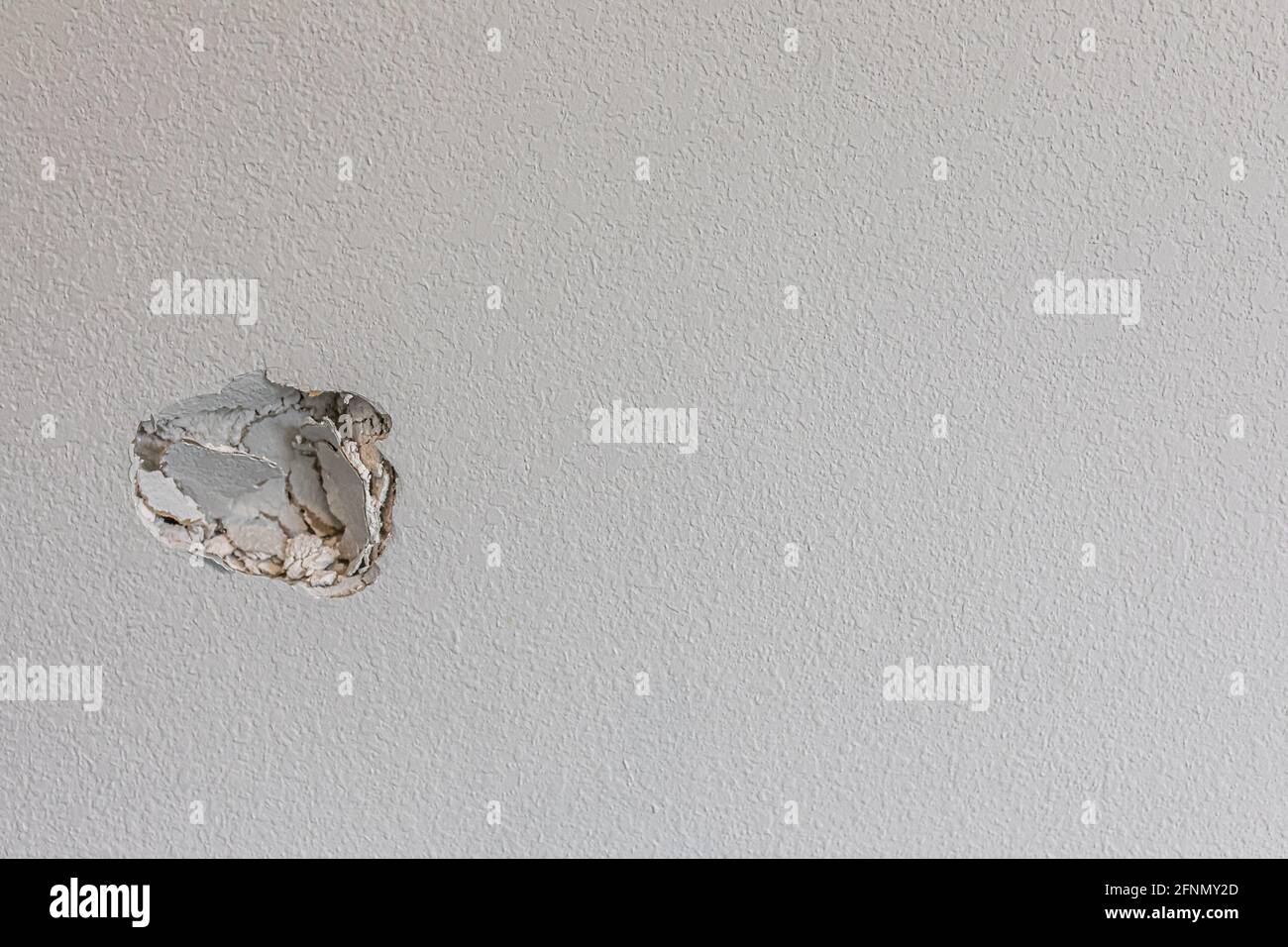 Fist punching through wall hi-res stock photography and images - Alamy