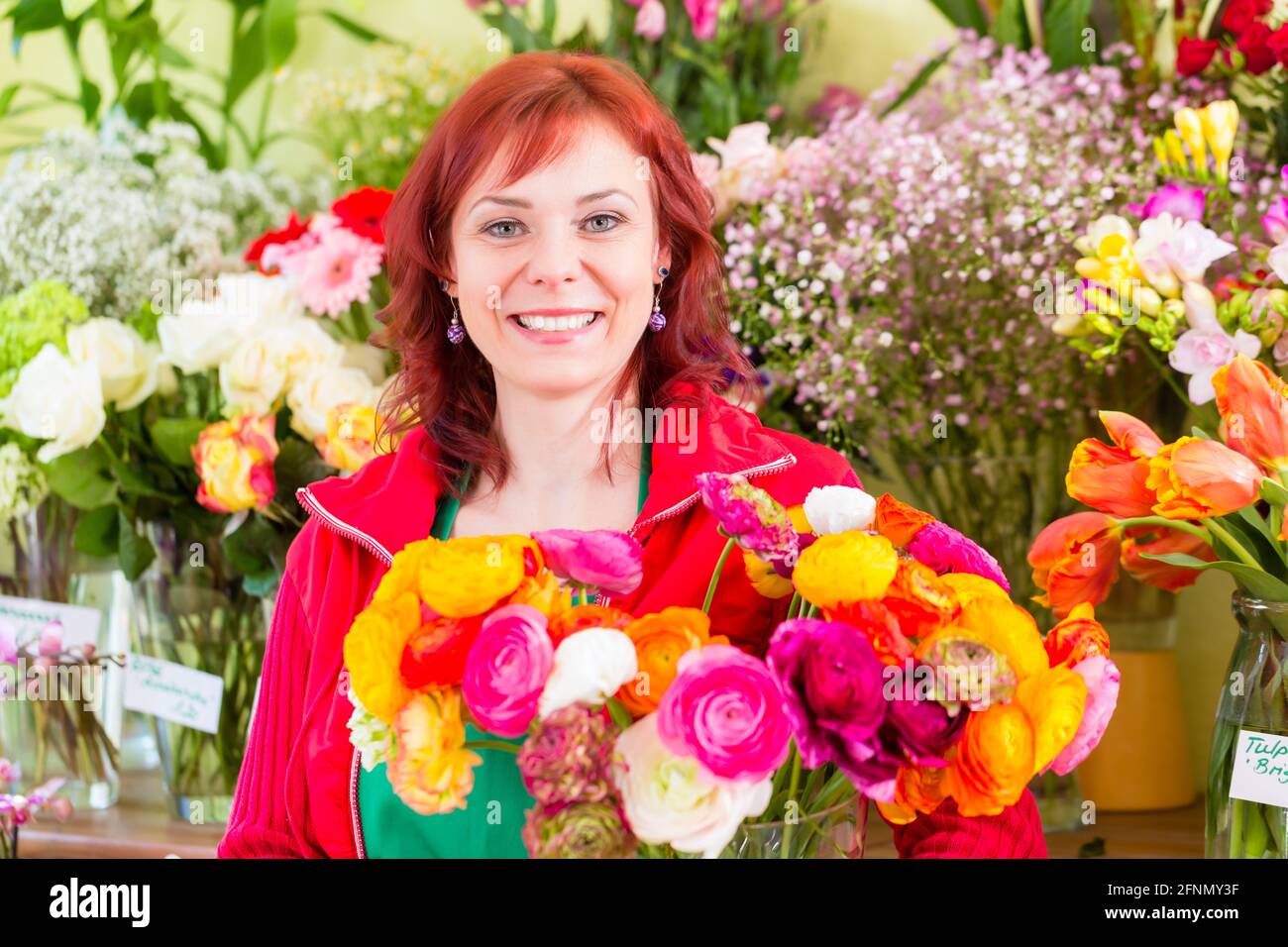 Caucasian florist selling bouquets hi-res stock photography and images ...