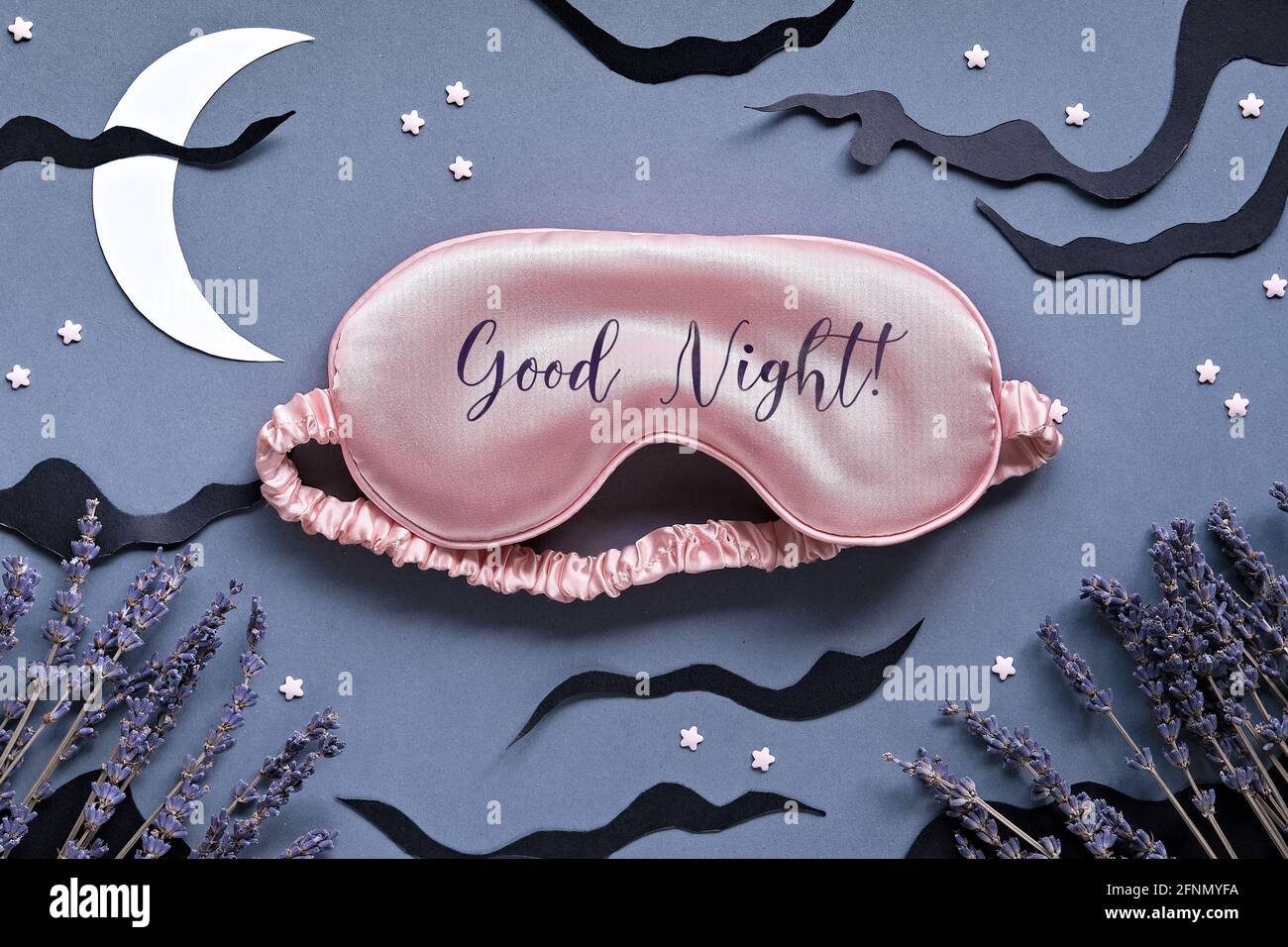Sleep mask with lavender on dark grey background with black clouds ...