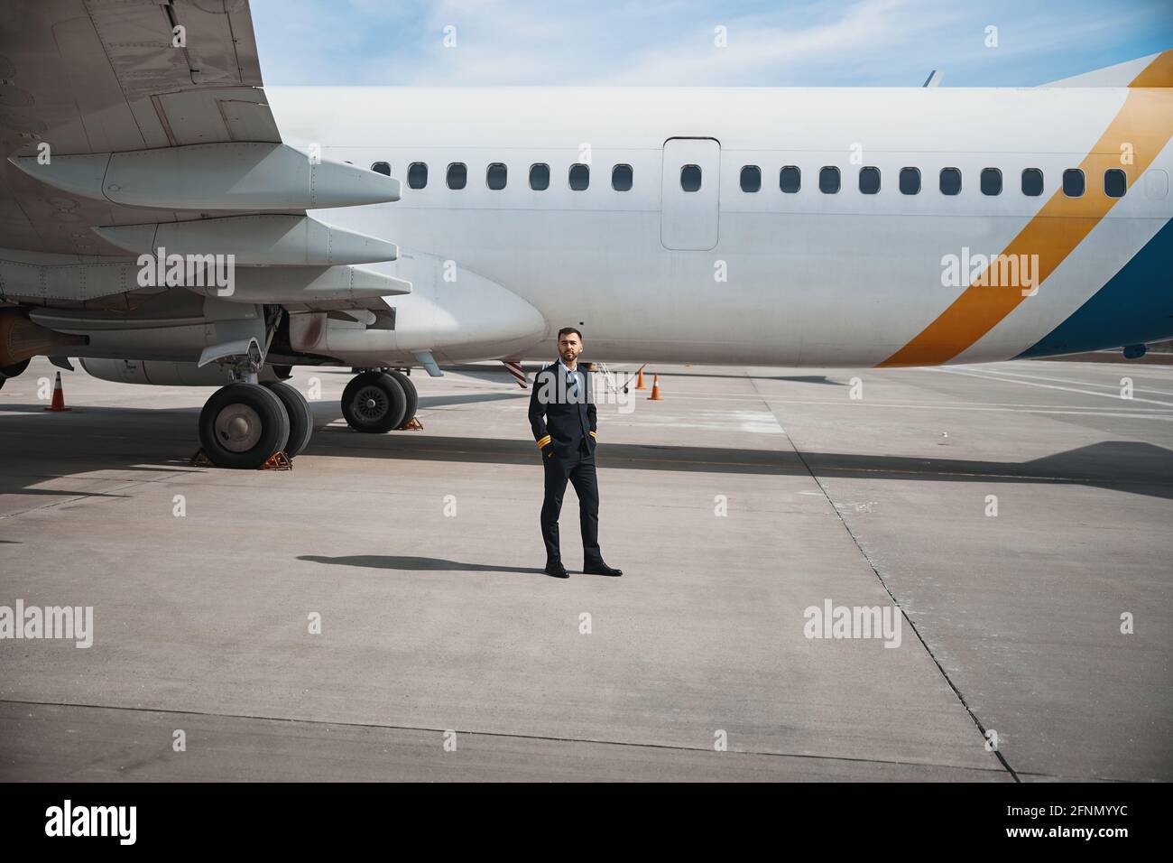 Pilot posing for photo next to his aircraft Stock Photo - Alamy