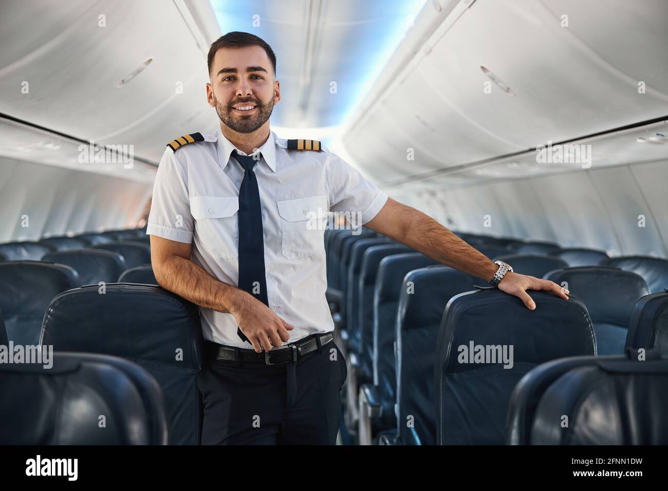 Airplane seat man smiling hi-res stock photography and images - Alamy