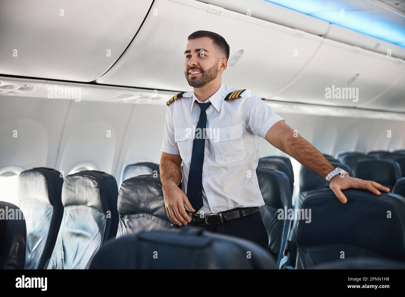 Airplane seat man smiling hi-res stock photography and images - Alamy