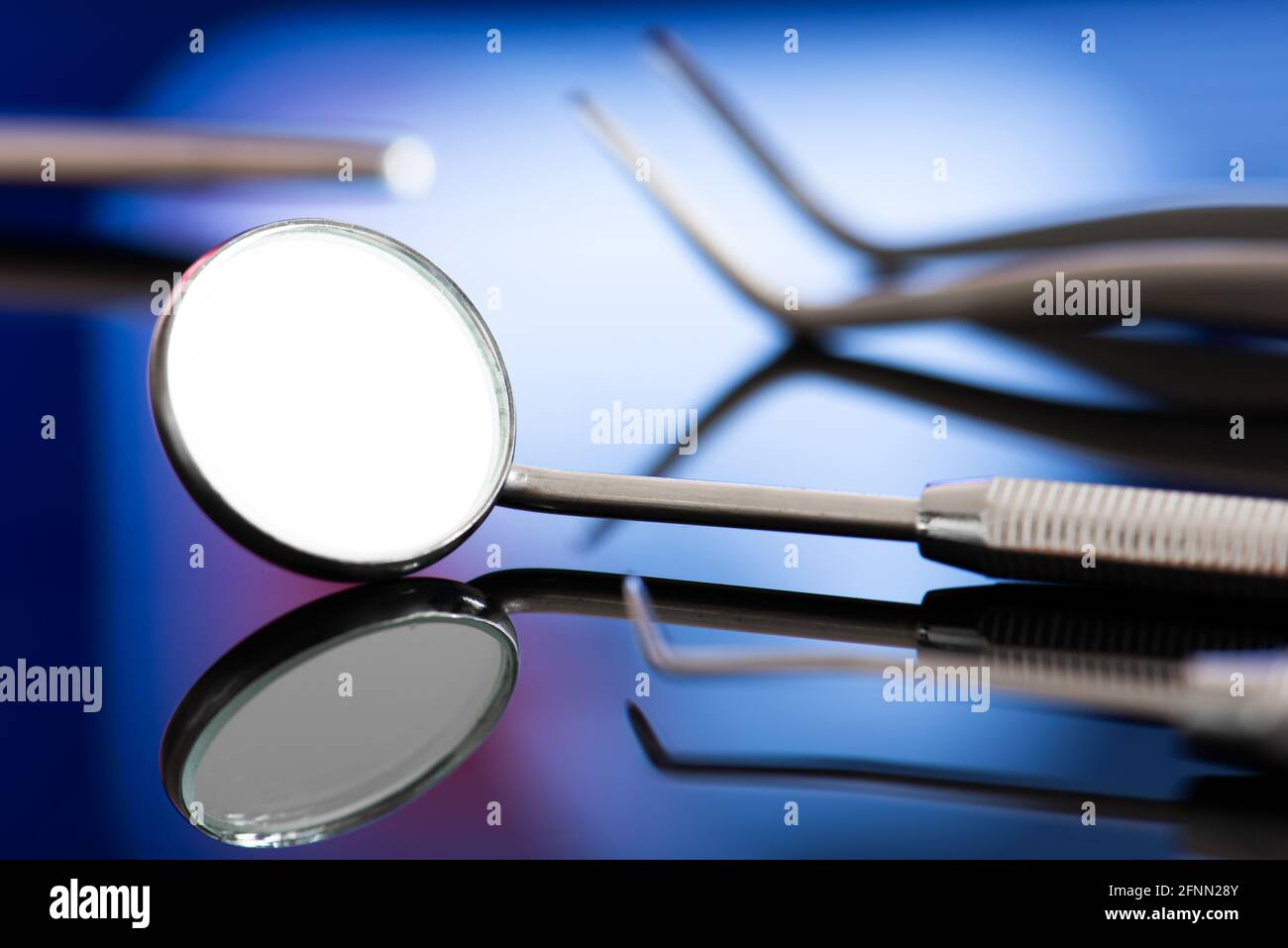 Dental tools on a reflective surface. Medical tools set Stock Photo - Alamy