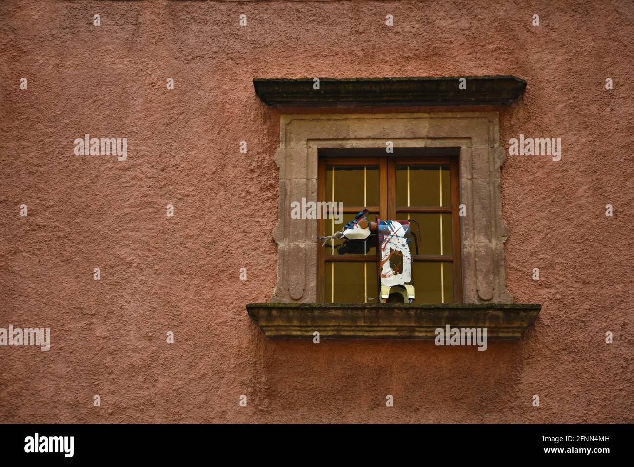 Old Colonial house window with stone trim, balcony with iron railing ...