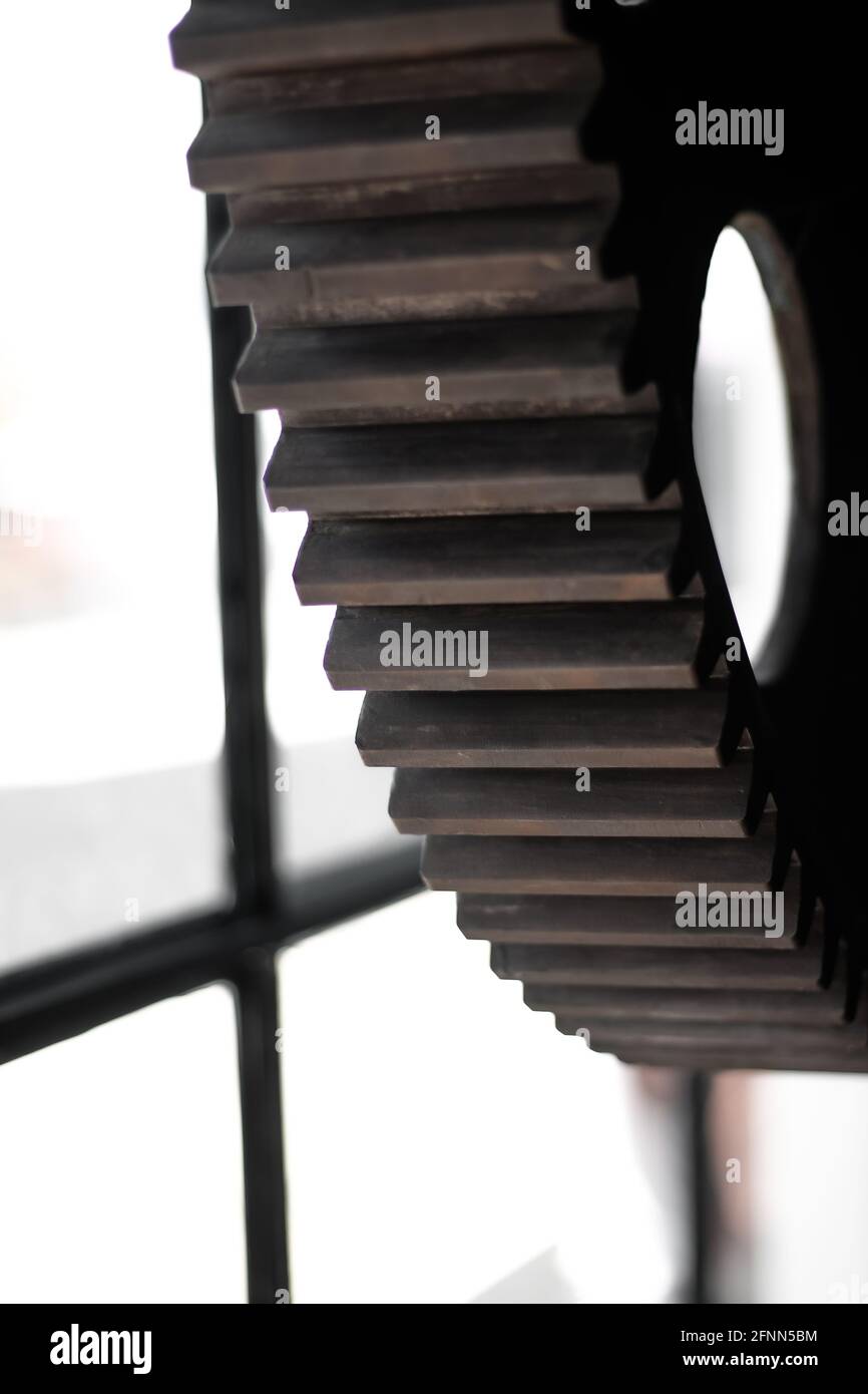 Close up of giant rustic industrial gear beside bright window Stock ...