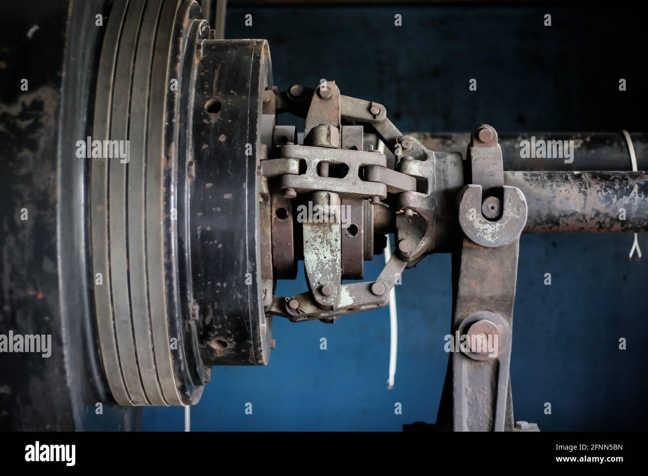 Rustic industrial ice can machine with blue background Stock Photo - Alamy