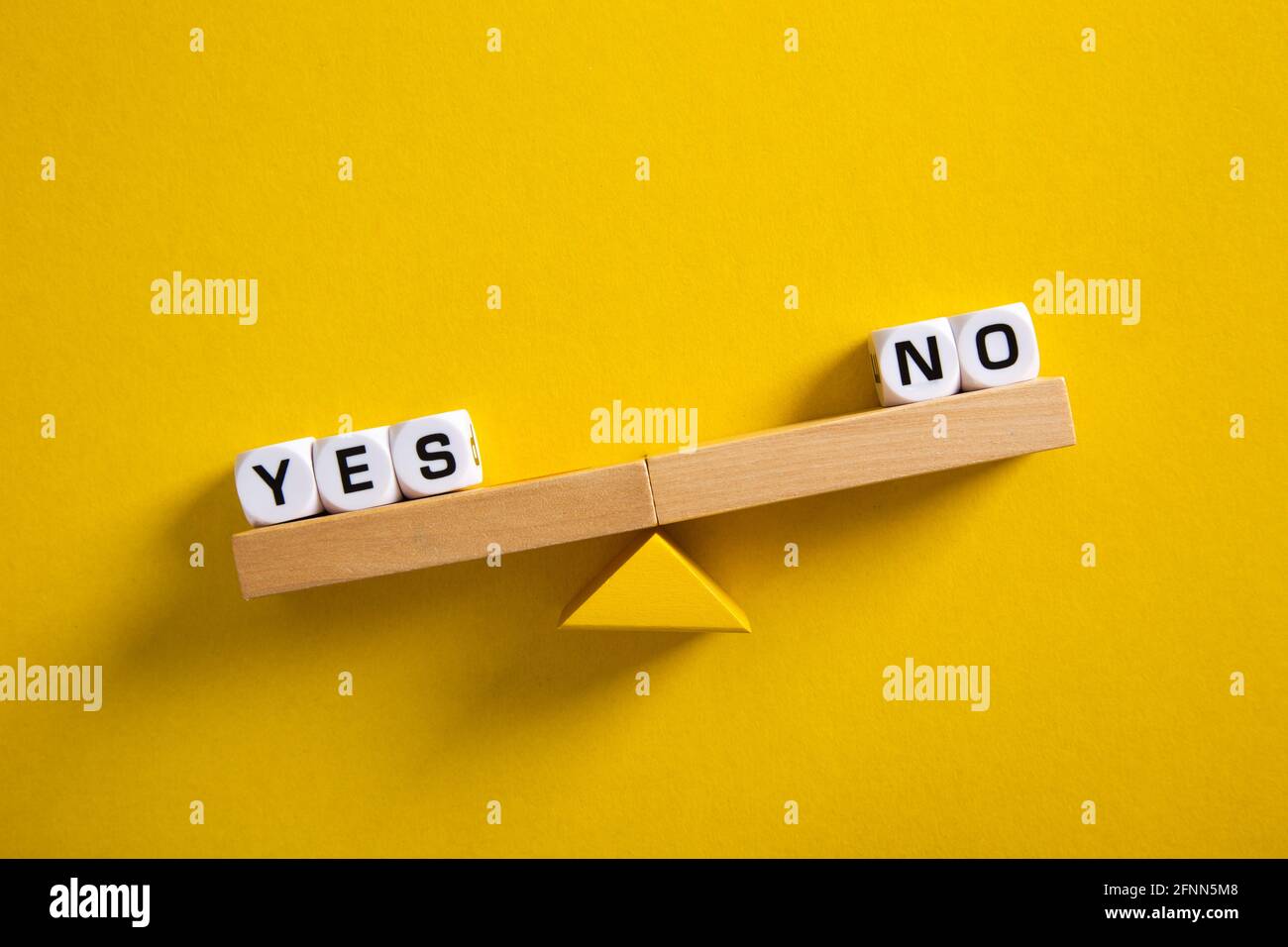 Yes vs no on seesaw hi-res stock photography and images - Alamy