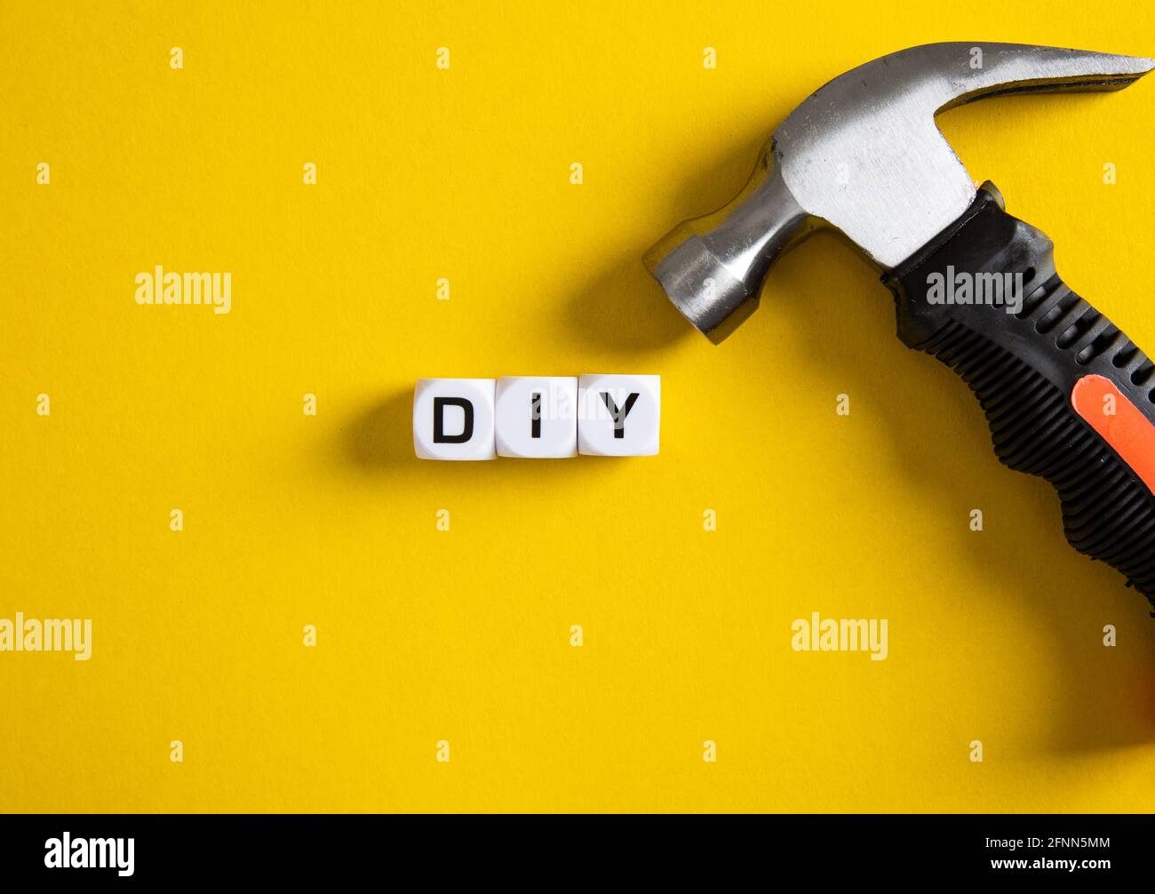 DIY concept. Block with DIY word on yellow background Stock Photo - Alamy