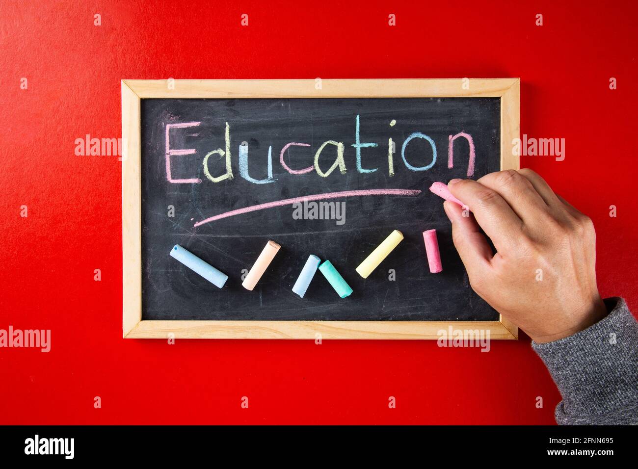 Hand writing word Education written on blackboard. Education Conceptual ...
