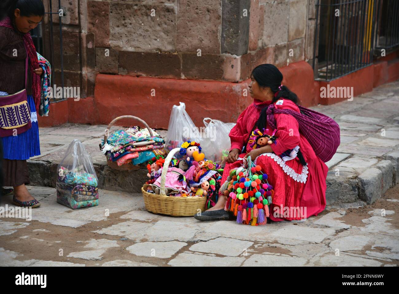 Indigenous woman selling authentic "Marias" the traditional handmade ...
