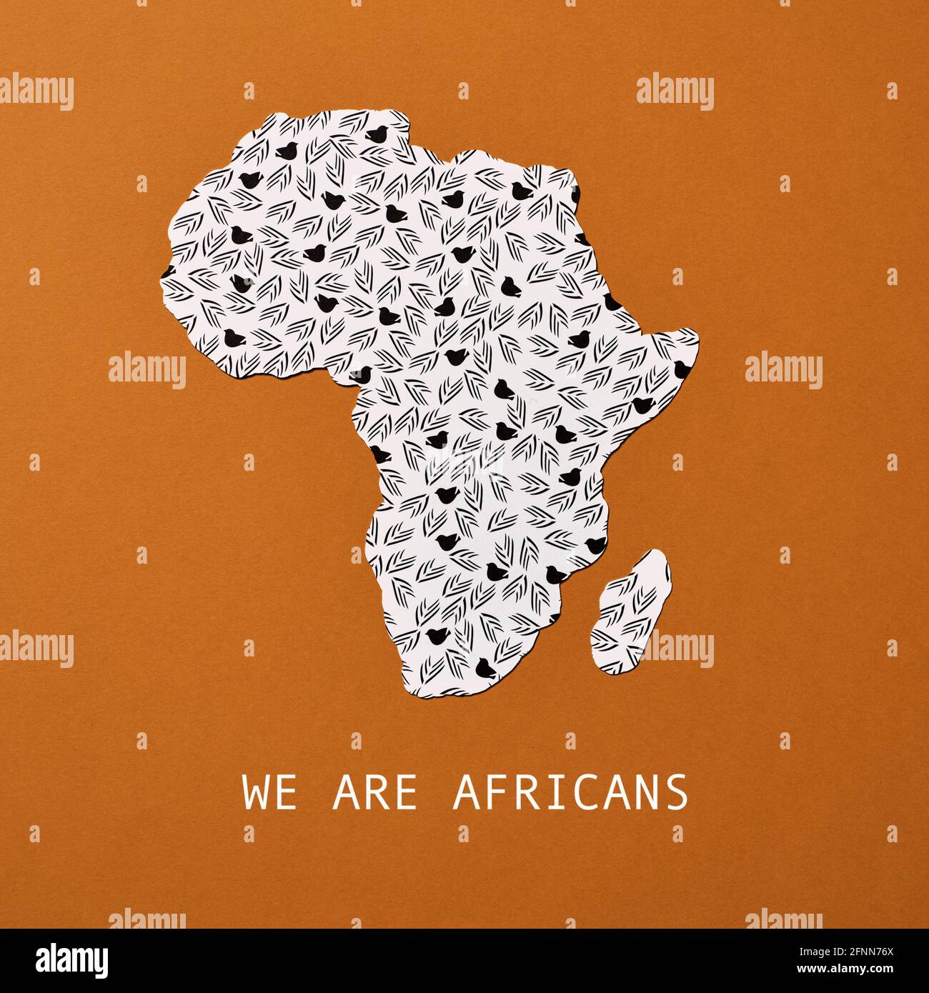 the silhouette of africa cut out from a patterned paper, and the text ...