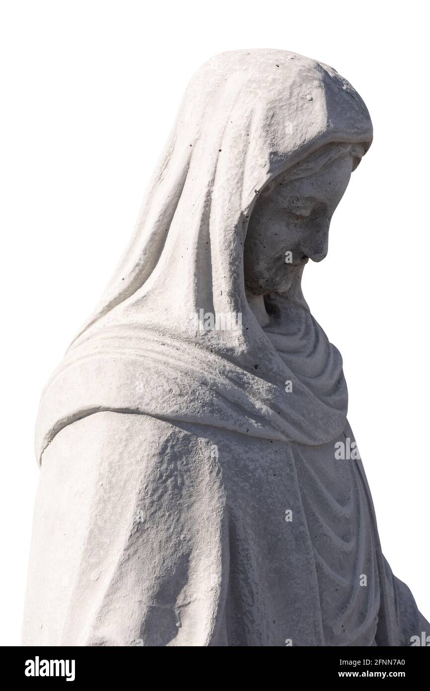 Close up side view of stone sculpture of virgin mary on white ...