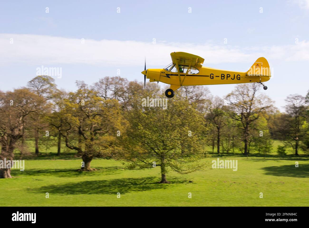 Piper PA-18 Super Cub plane G-BPJG taking off from Henham Park Suffolk ...