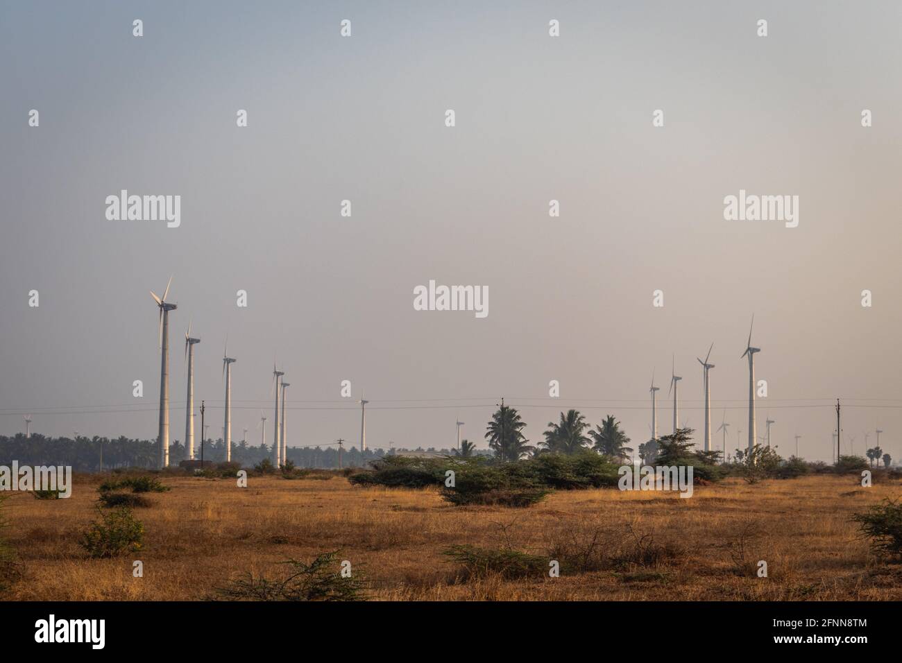 Windmills many heading in one direction parallel view. Windmills with ...