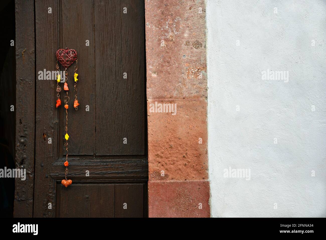 Antique wooden door with stone trim in San Miguel de Allende ...